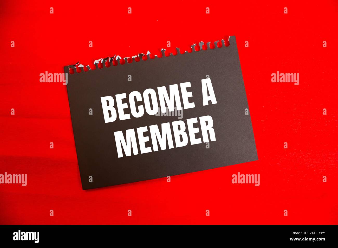 Become a member message written on ripped black paper with red ...