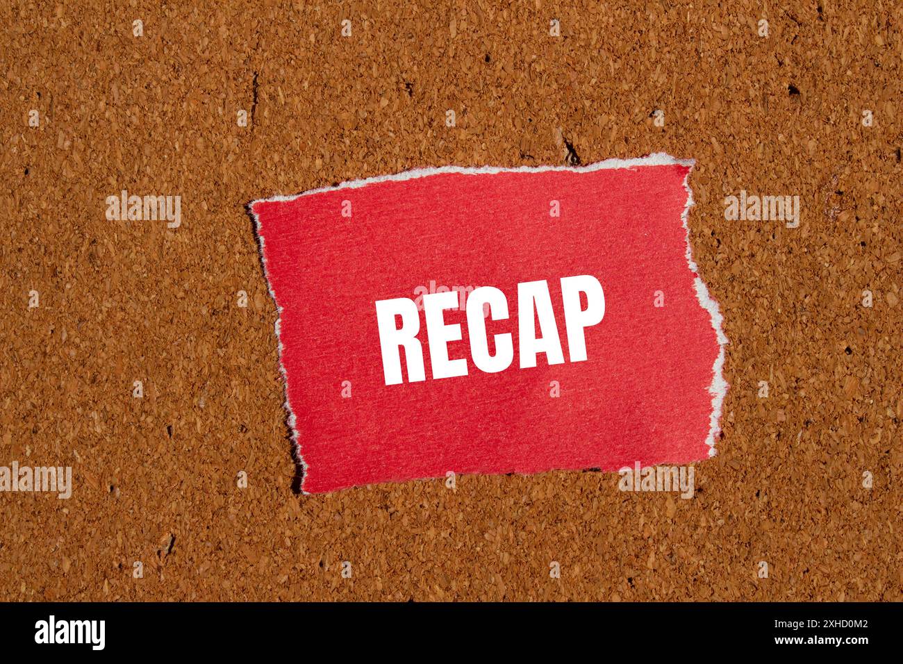 Recap word written on ripped red paper piece with brown background ... Recap word written on ripped red paper piece with brown background ...