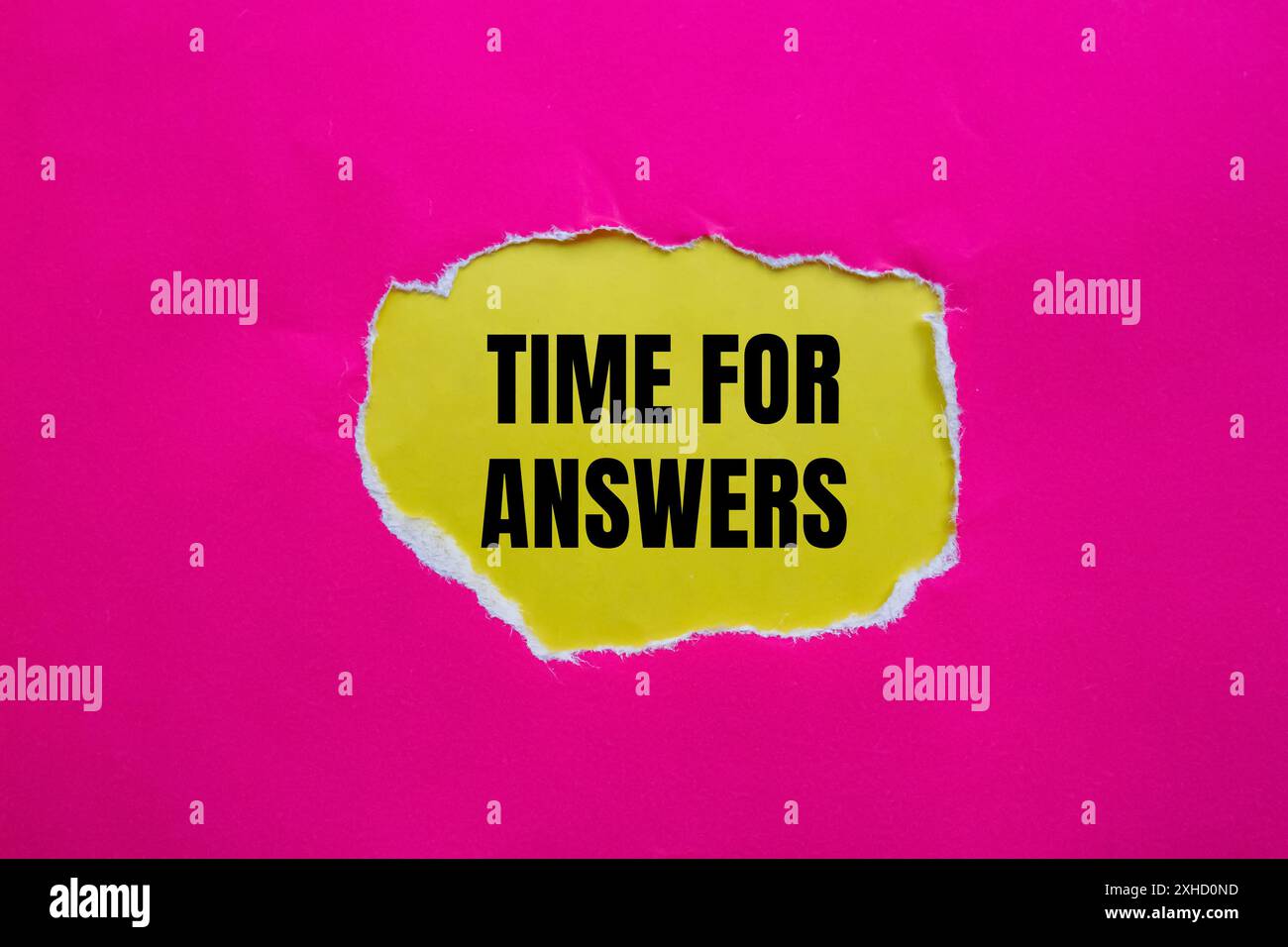 Time for answers words written on ripped pink paper with yellow ...