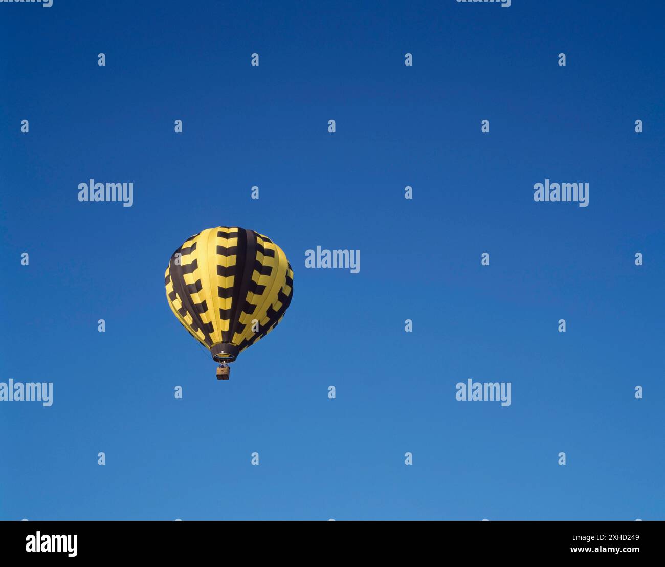 Black and yellow hot air ballon in flight, Gatineau, Outaouais, Quebec ...