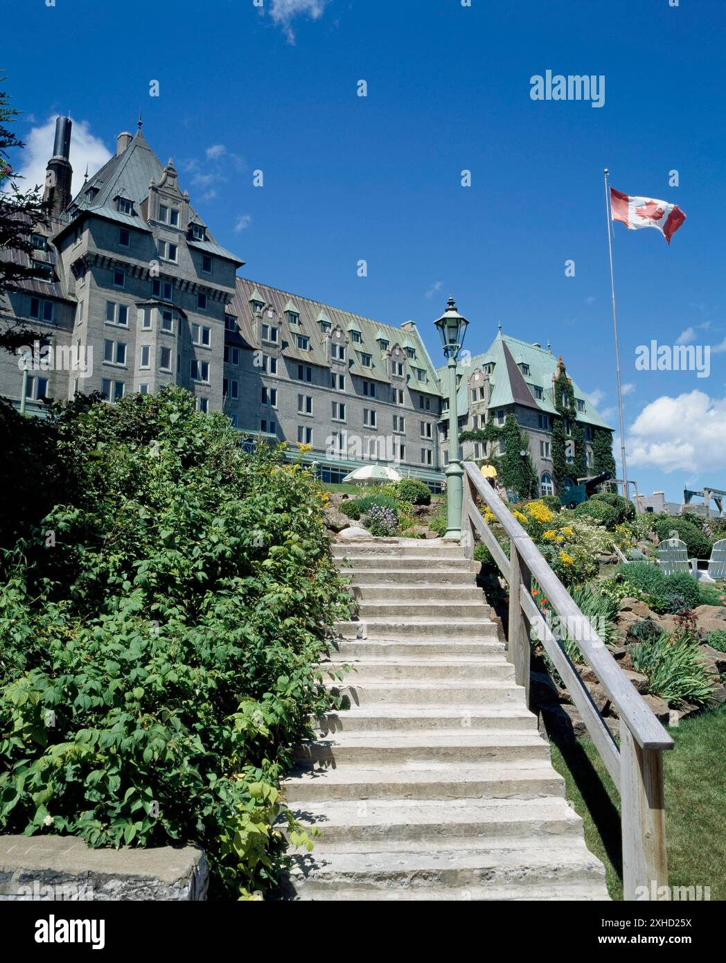 Stairs leading to Manoir Richelieu facade with landscaped frontyard in ...