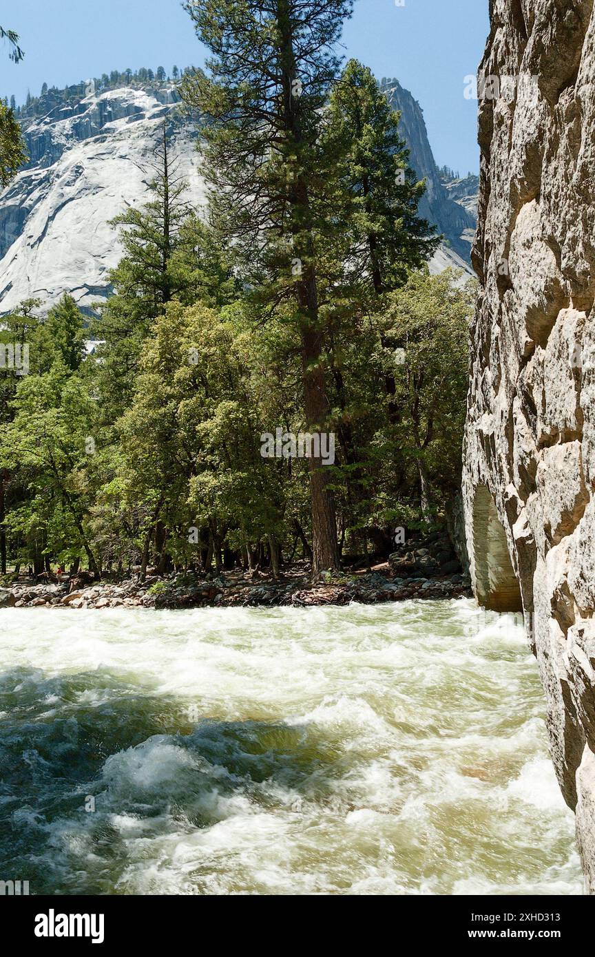 Fast flowing Merced river after Spring rains and snow melt in Yosemite ...