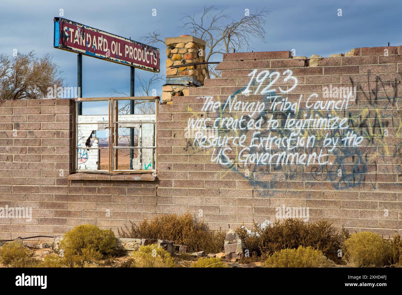 An abandon gas station with a Navajo protest writing on the wall Stock ...