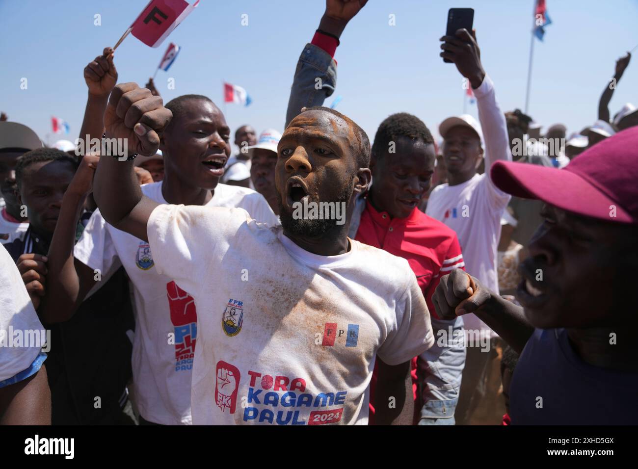 Supporters of Rwanda's President Paul Kagame dance during his final ...