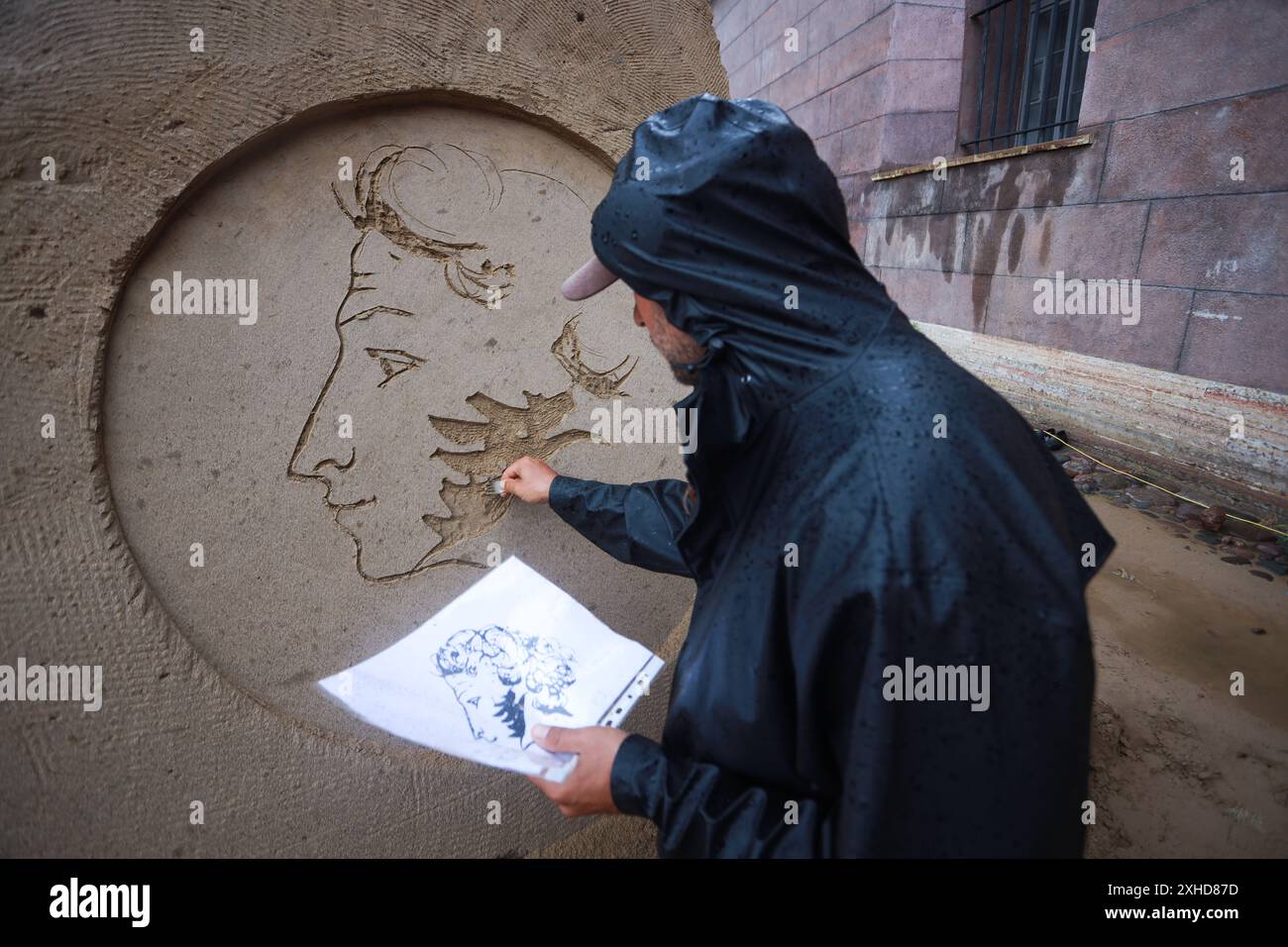 A sculpture man creates a portrait of Russian poet and playwright ...