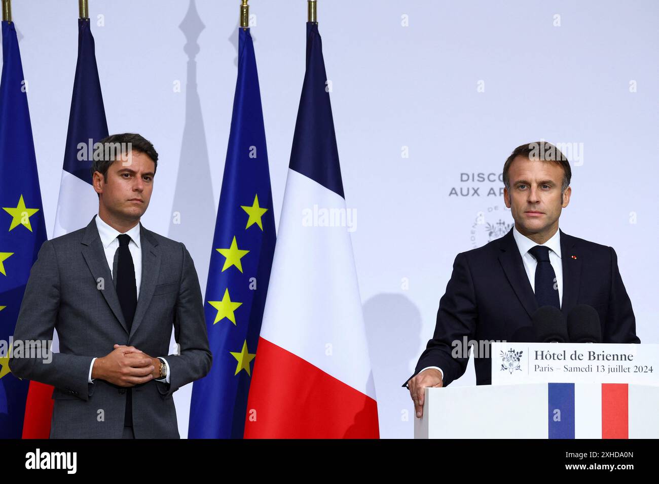 French President Emmanuel Macron, right, flanked by Prime Minister ...