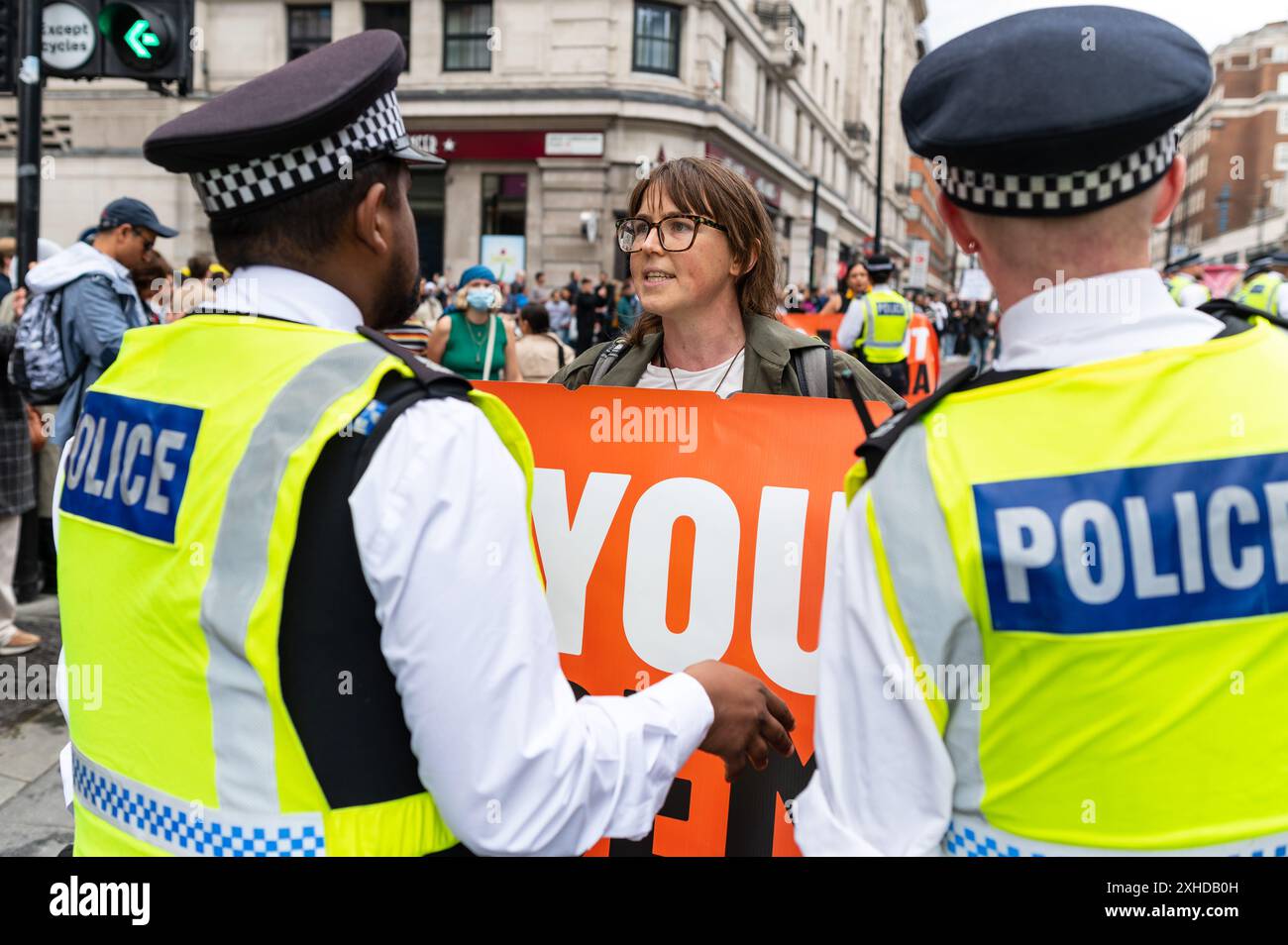 London, UK. 13 July 2024. Youth Demand activists block the oncoming ...