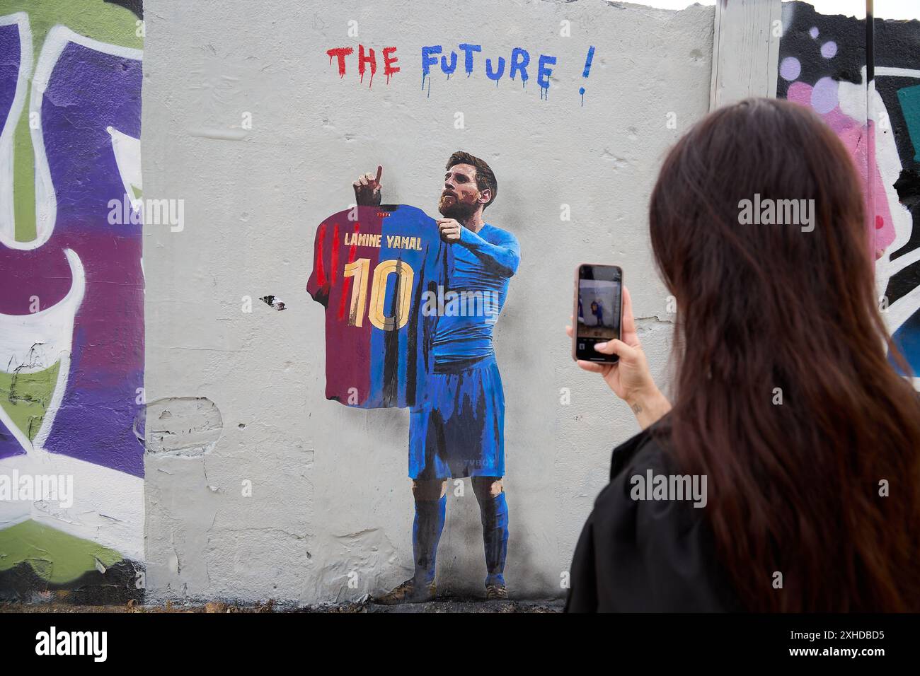 Graffiti by the artist TV Boy featuring Leo Messi holding an FC ...