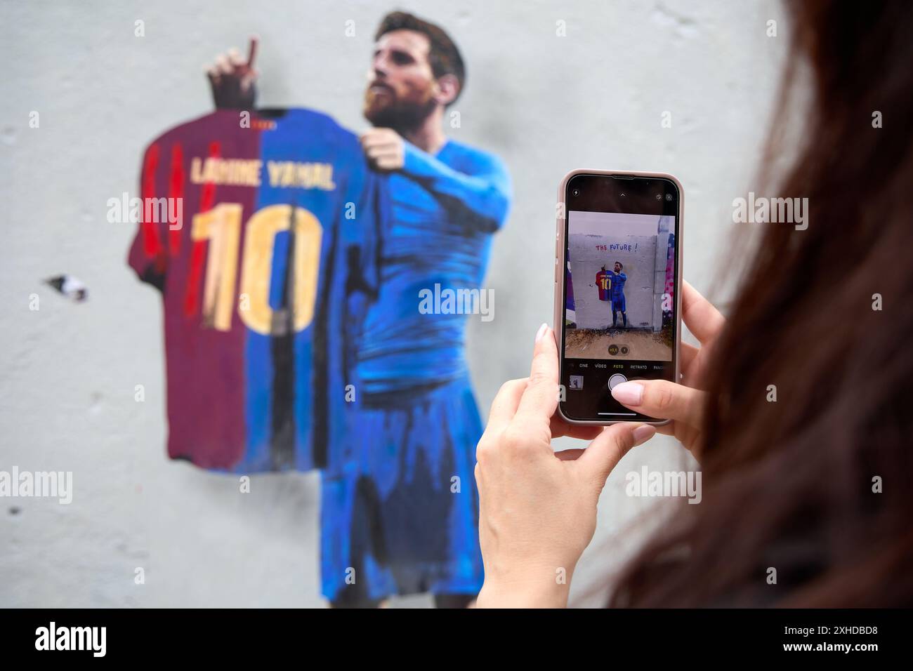Graffiti by the artist TV Boy featuring Leo Messi holding an FC ...