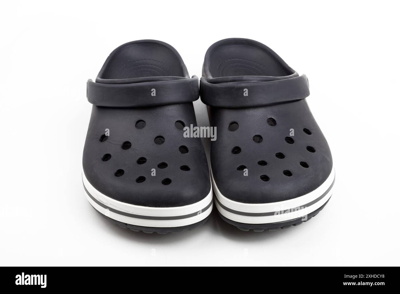 Black plastic shoes wearing for leisure isolated on white background ...