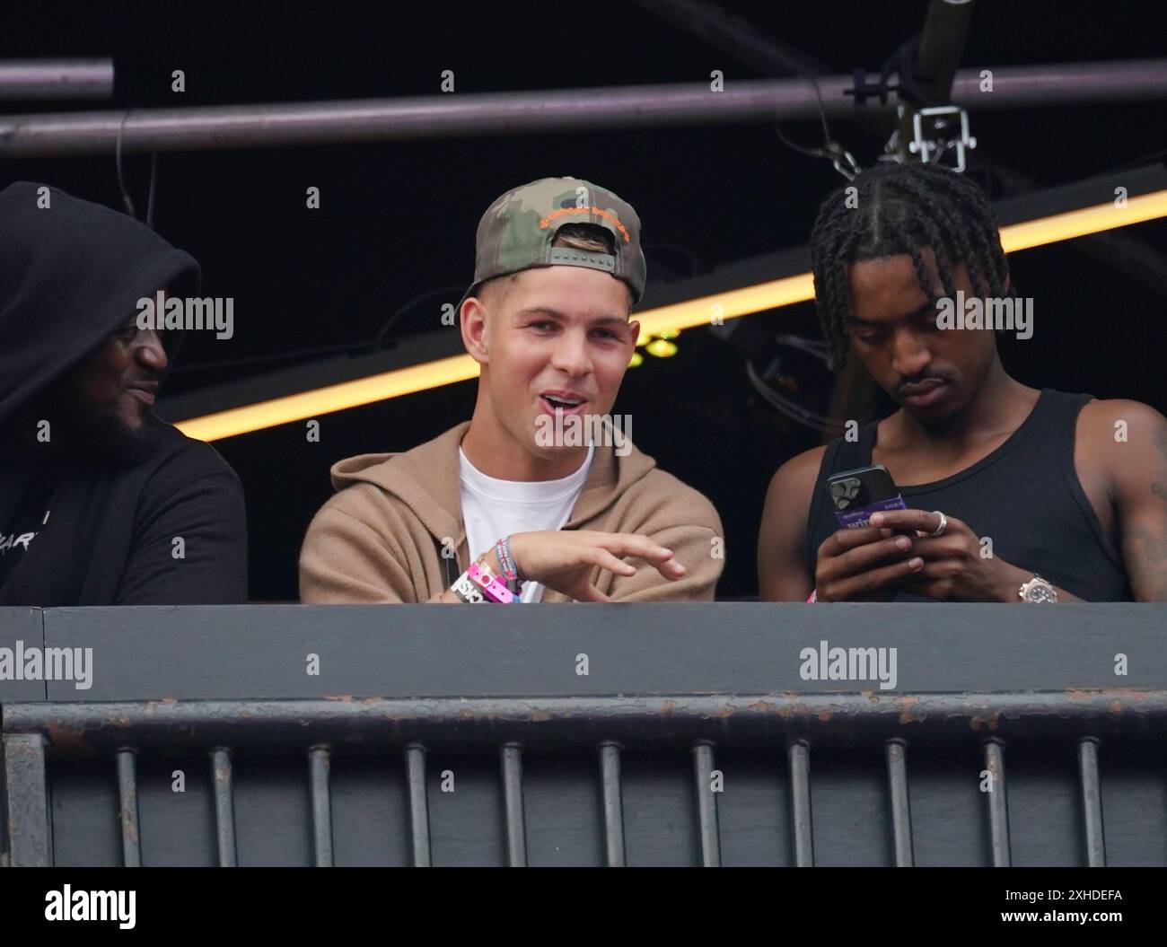 Arsenal football player Emile Smith Rowe (centre) watching J Hus ...