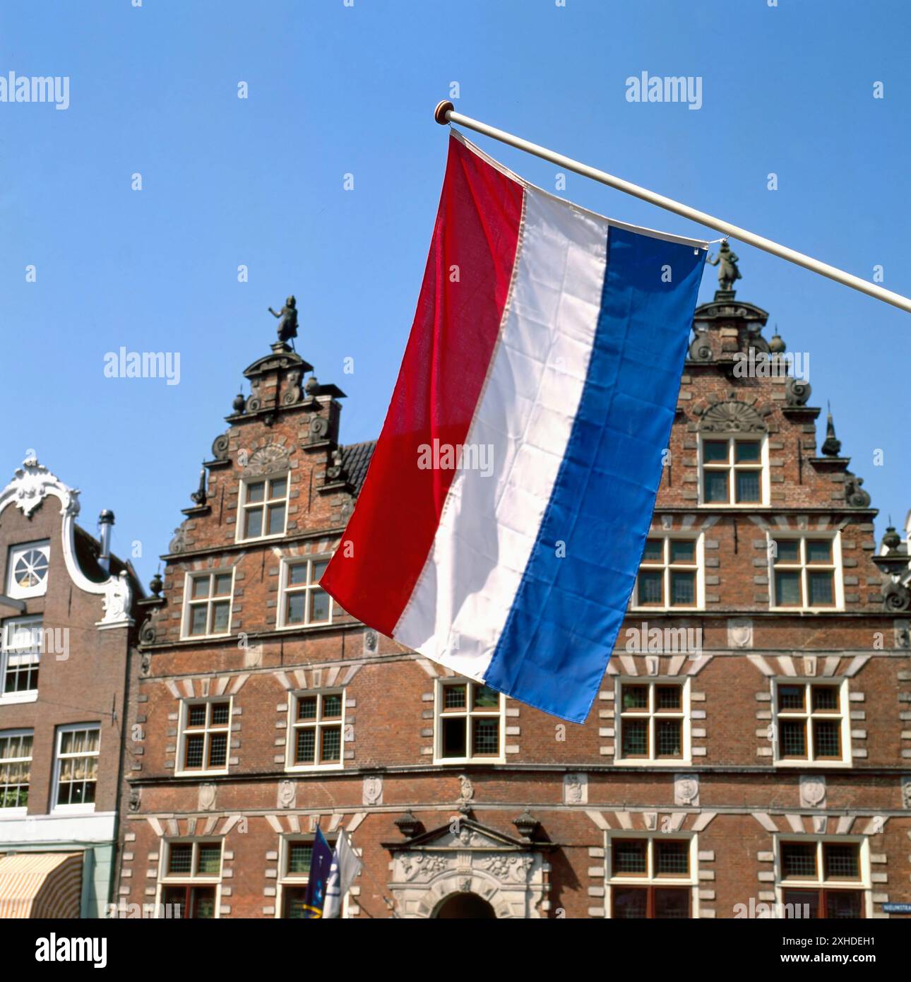 Facade of a monumental houses with stepped gables in the Netherlands.At ...