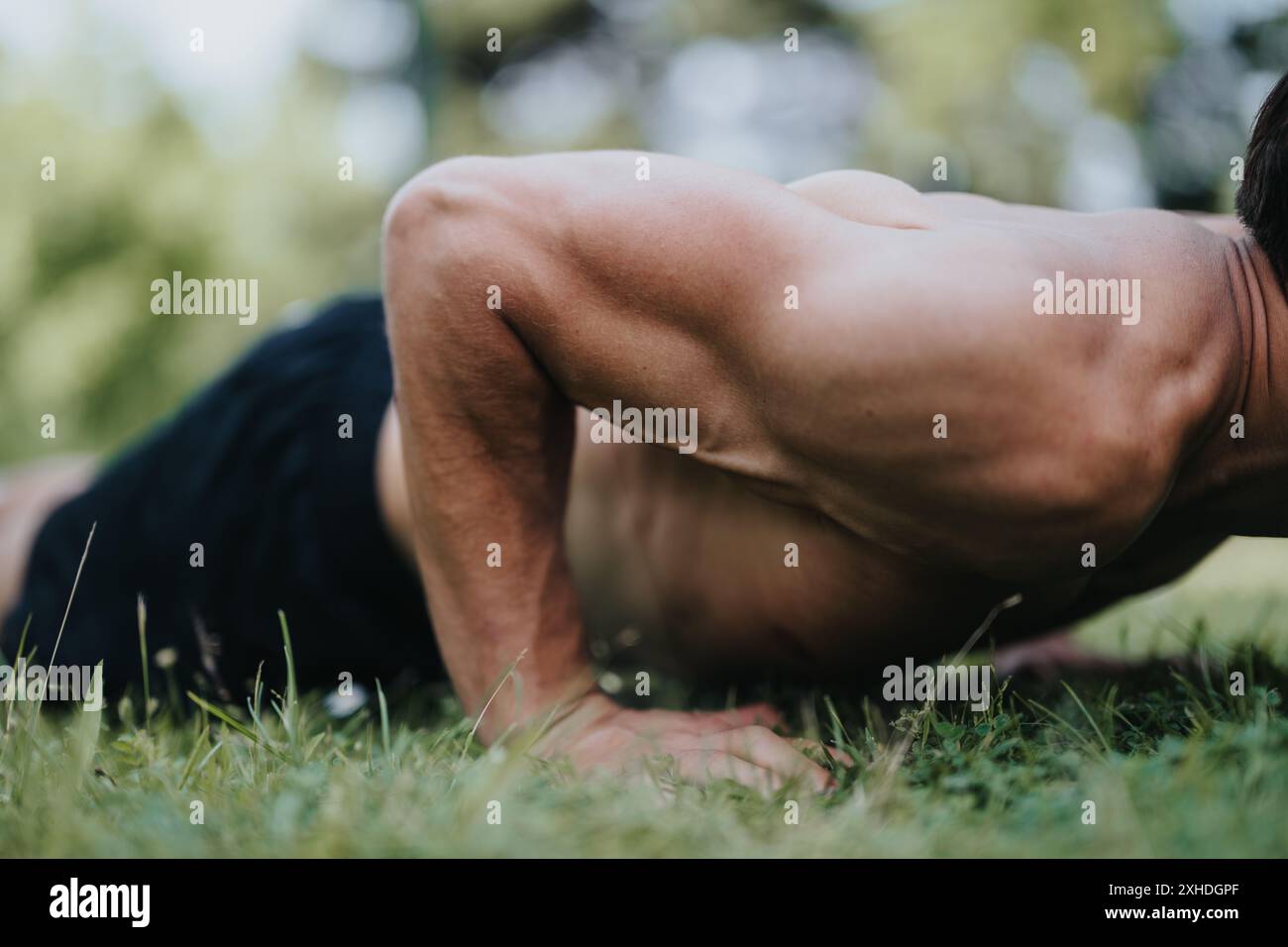 Close-up of a man's arm while doing push-ups in a sport park Stock ...