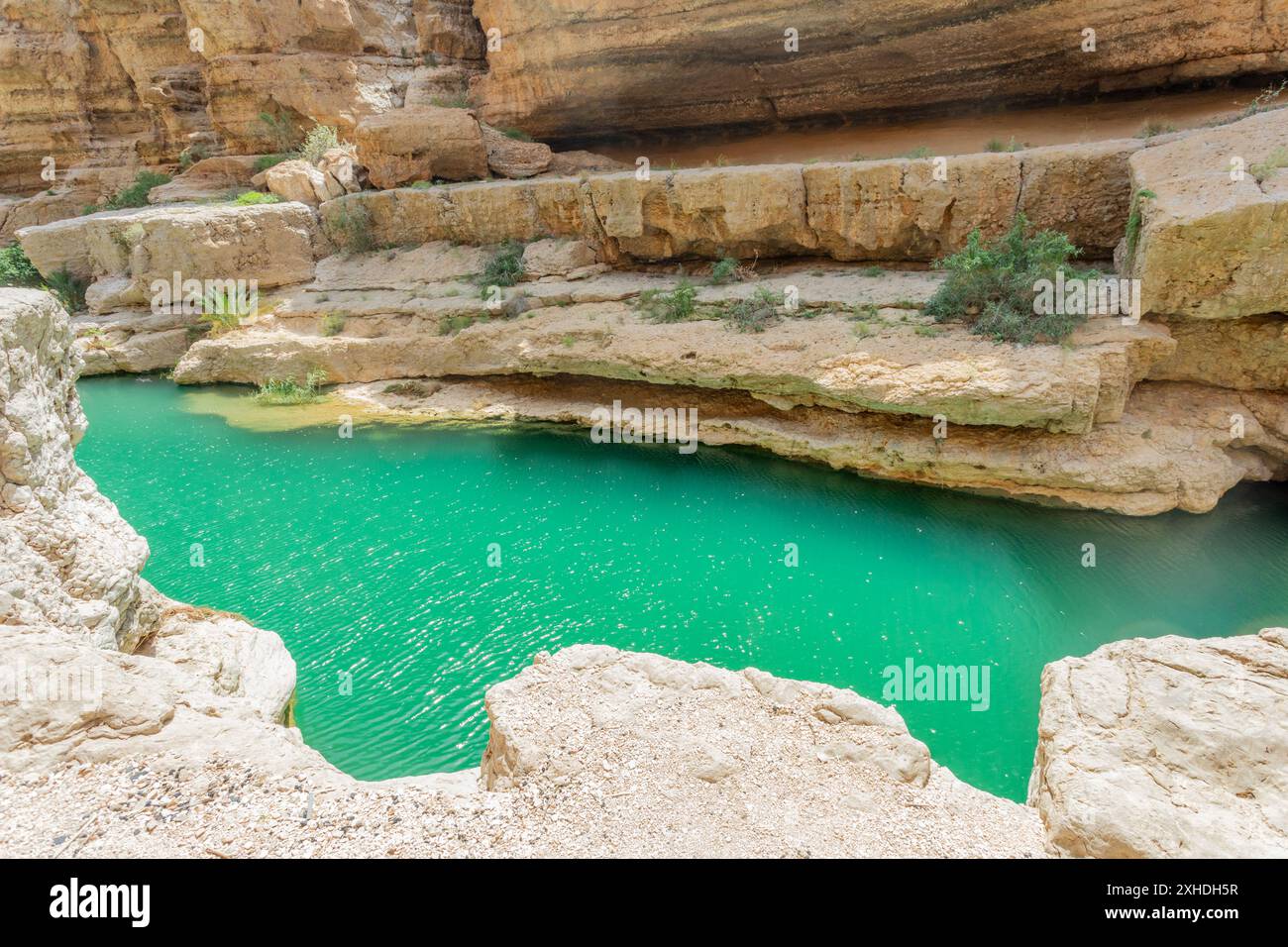 Green lake waters in the middle of Wadi Shab canyon, Tiwi, sultanate ...