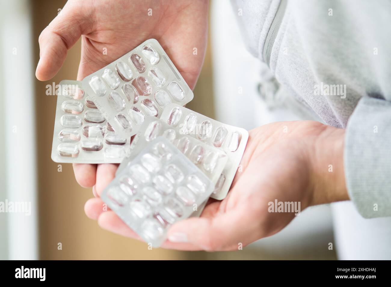 Male hands holding empty pill blister packs, man holding empty package ...