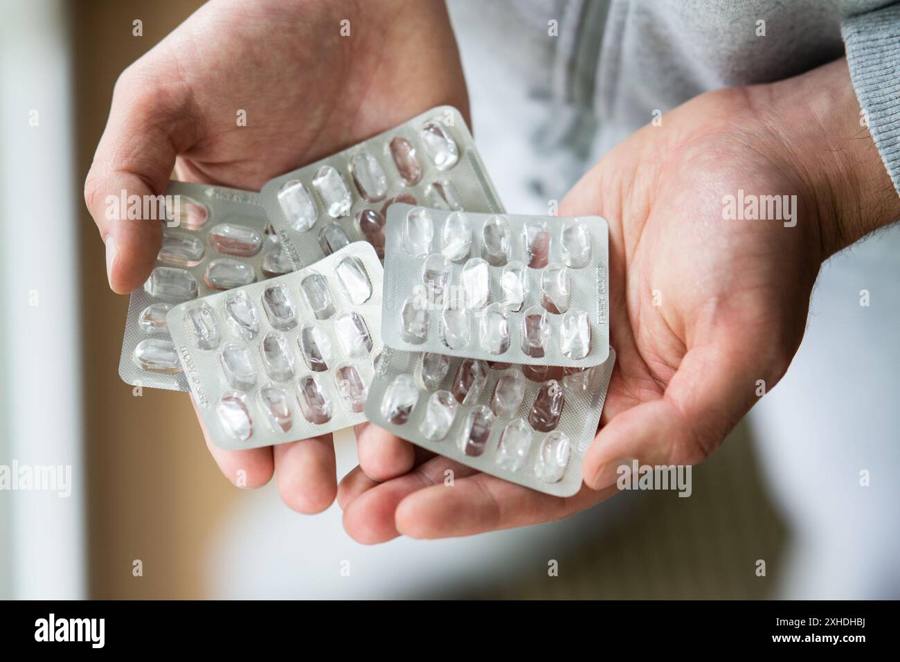 Male hands holding empty pill blister packs, man holding empty package ...