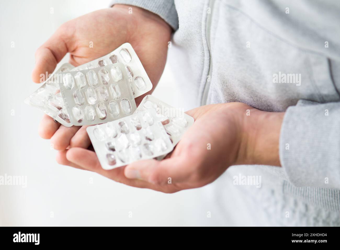 Male hands holding empty pill blister packs, man holding empty package ...