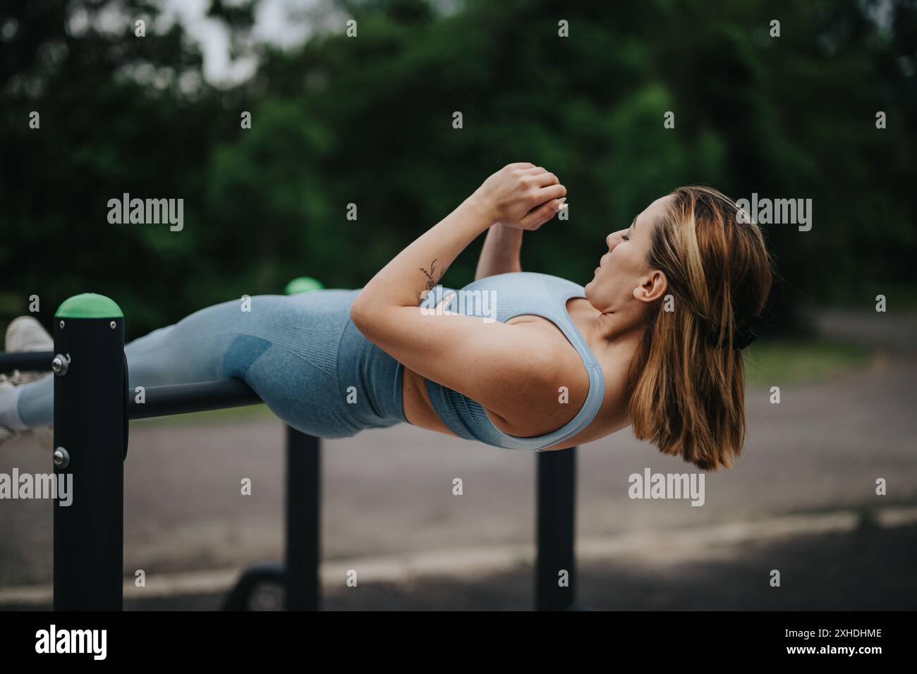 Woman performing calisthenics on hi-res stock photography and images ...