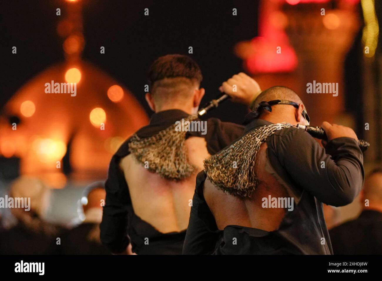 Shiite faithful pilgrims self-flagellate with chains as a sign of grief ...