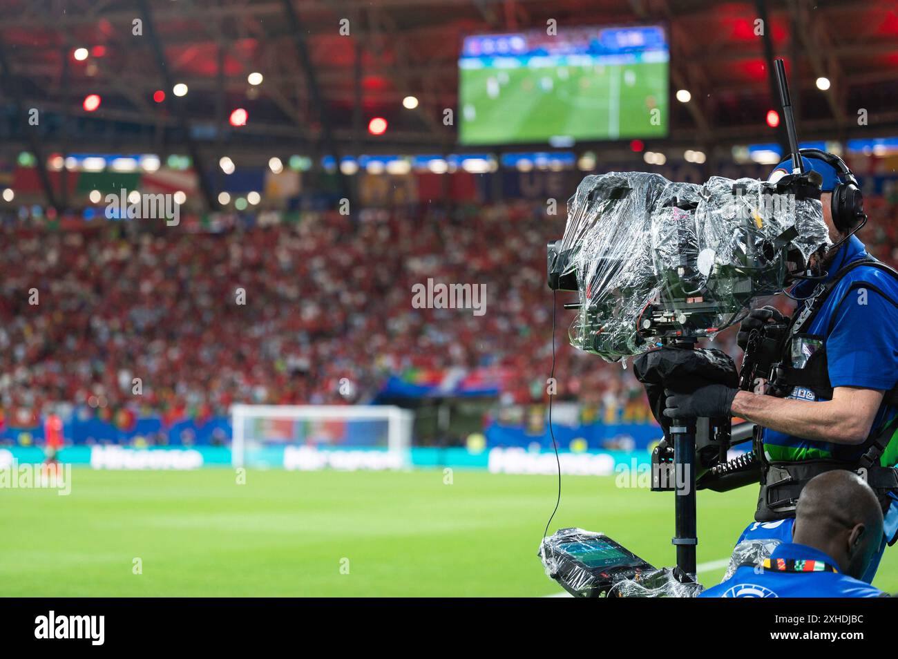Man carries TV camera on the stabilizer at football stadium Stock Photo ...