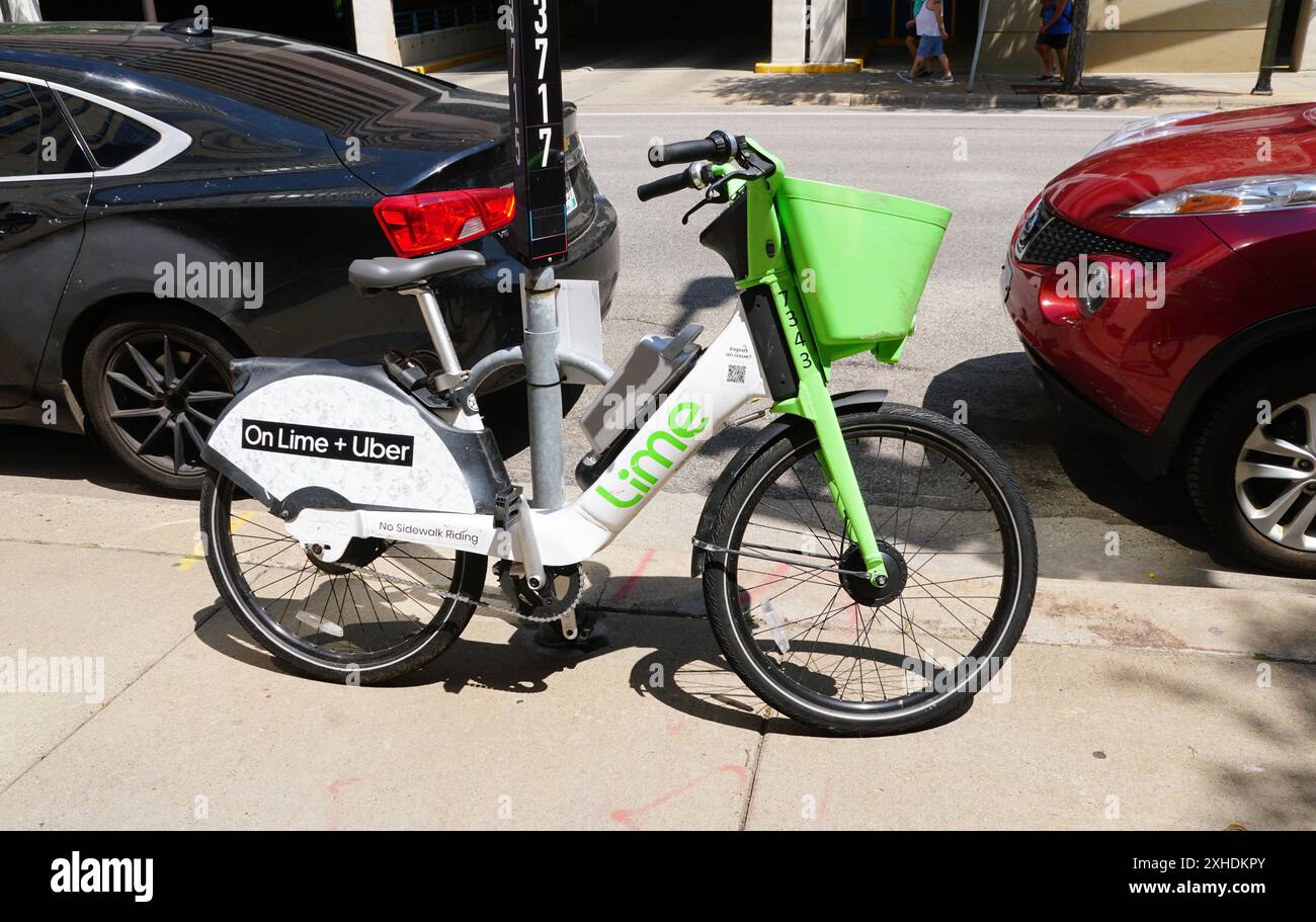 Minneapolis, Minnesota, U.S.A - July 12, 2024 - The On Lime and Uber e ...