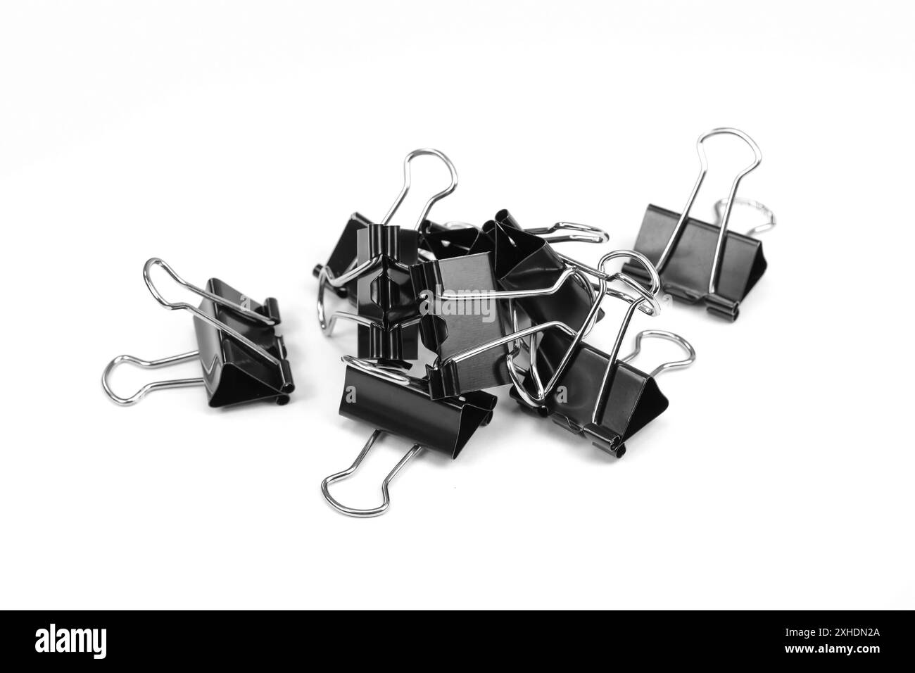 black paper clips isolated on white Stock Photo - Alamy