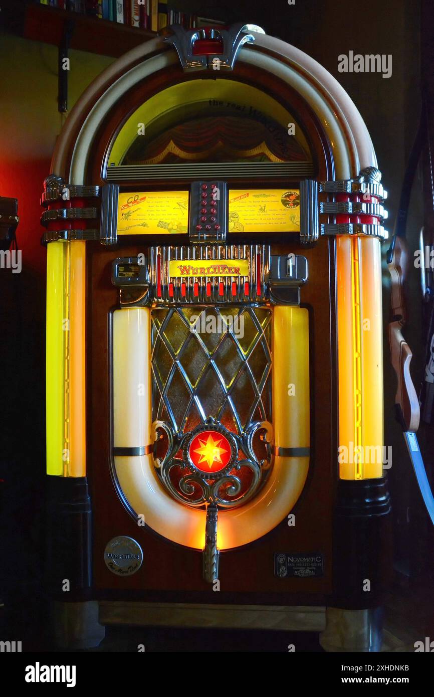 Retro jukebox in the corner of a restaurant by a set of stairs Stock ...