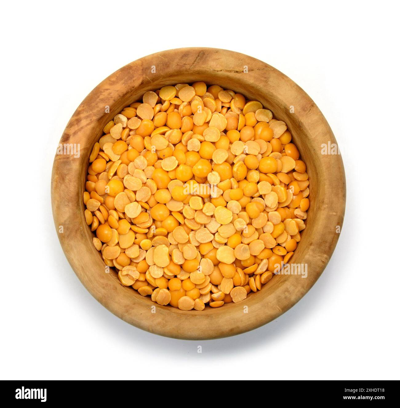 Toor dal or split yellow lentils in a wooden bowl isolated. Split ...