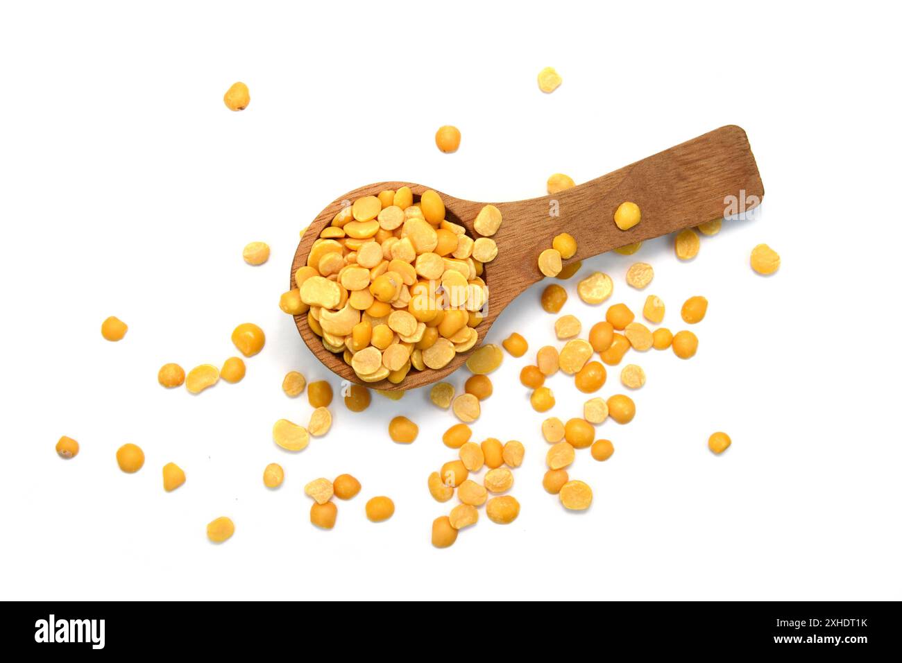 Toor dal or split yellow lentils in a wooden spoon isolated. Split ...