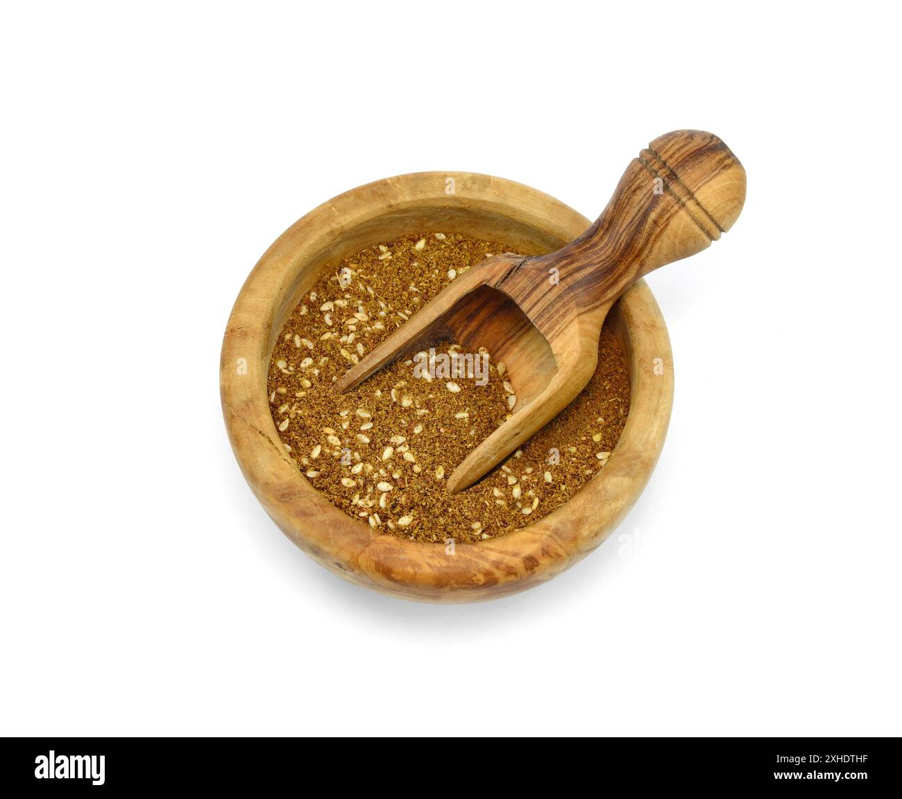 Zaatar spice in a wooden bowl isolated on white. Pile of zatar (za'atar ...