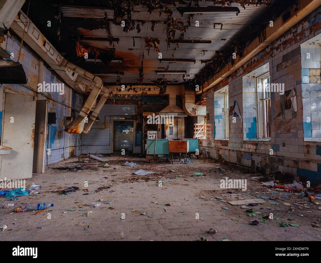 Abandoned and ruined kitchen of closed factory canteen or restaurant ...