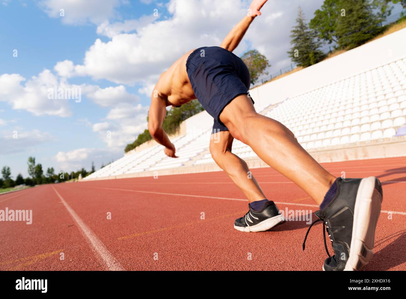 Close up of an athlete in a starting position looking determined and ...