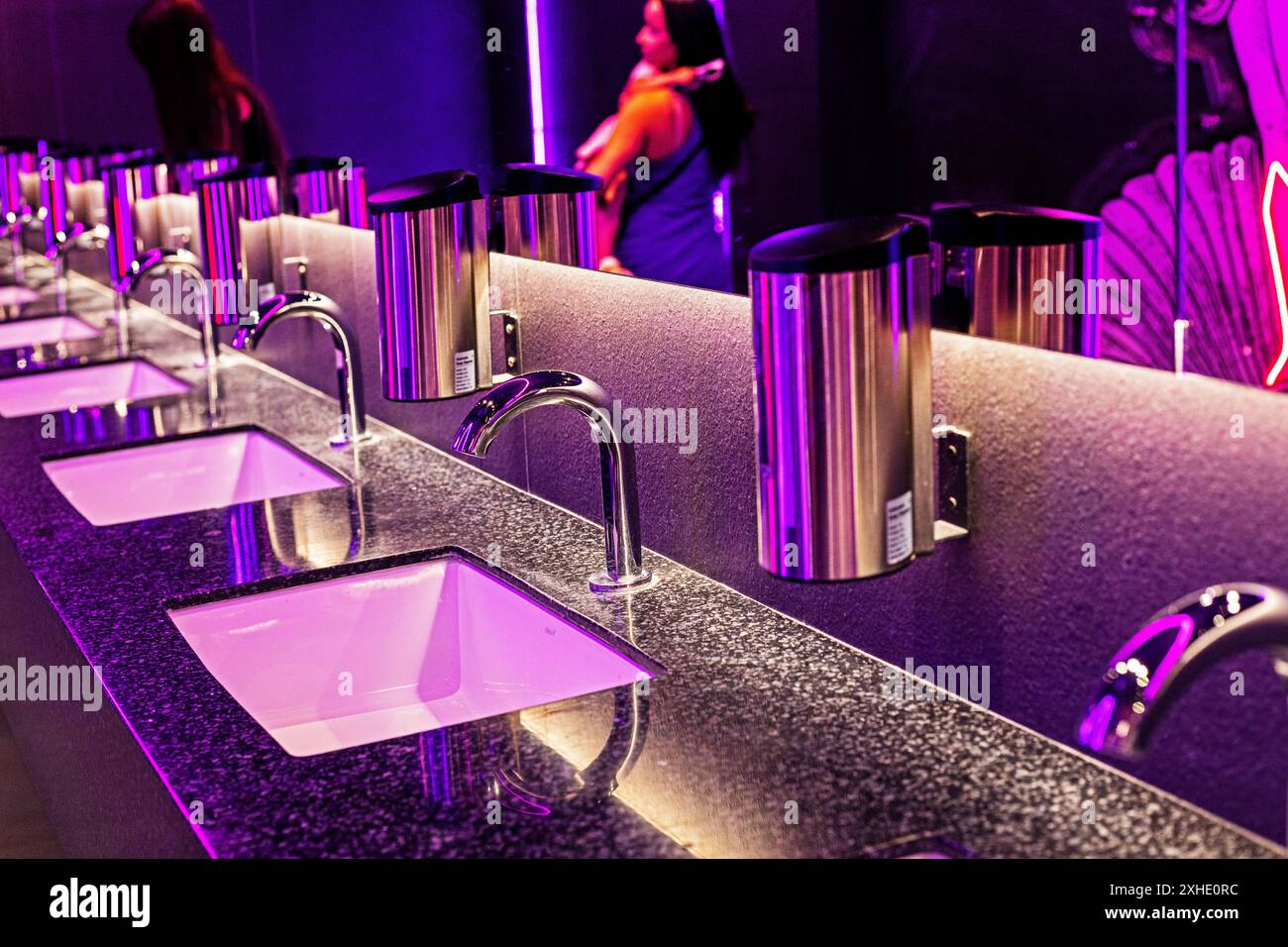 modern interior in the toilet room with a faucet and a mirror with ...