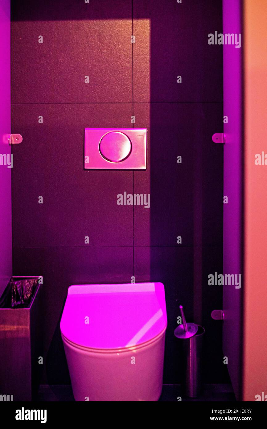 modern interior in the toilet room with purple lighting in the cinema ...