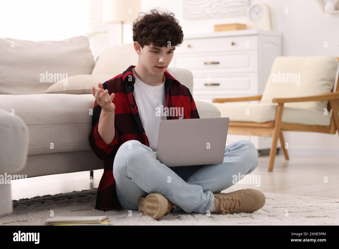 Teenager working with laptop at home. Remote job Stock Photo - Alamy
