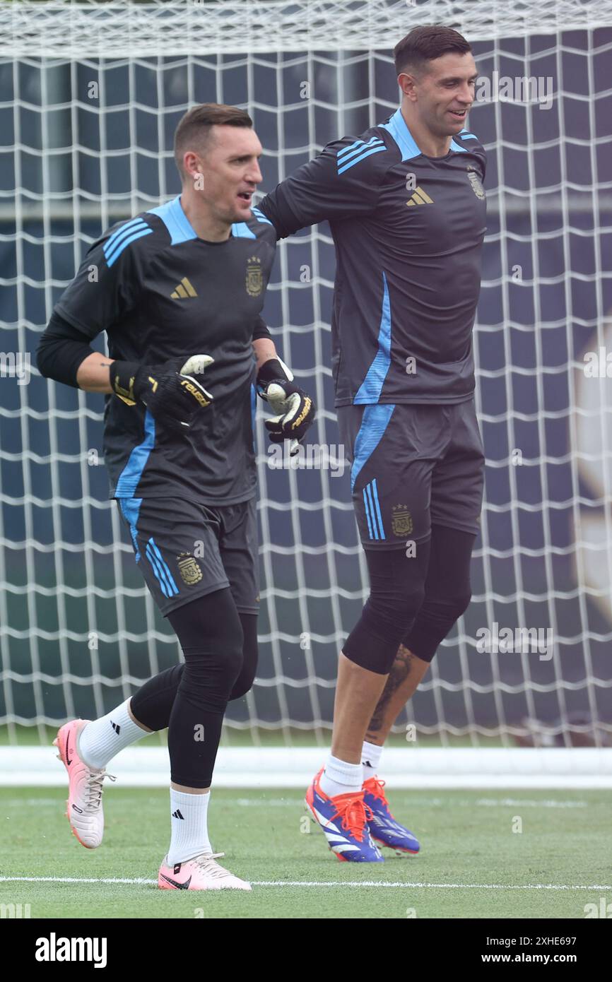 Argentina's goalkeepers (R) Emiliano Martinez and Franco Armani take ...