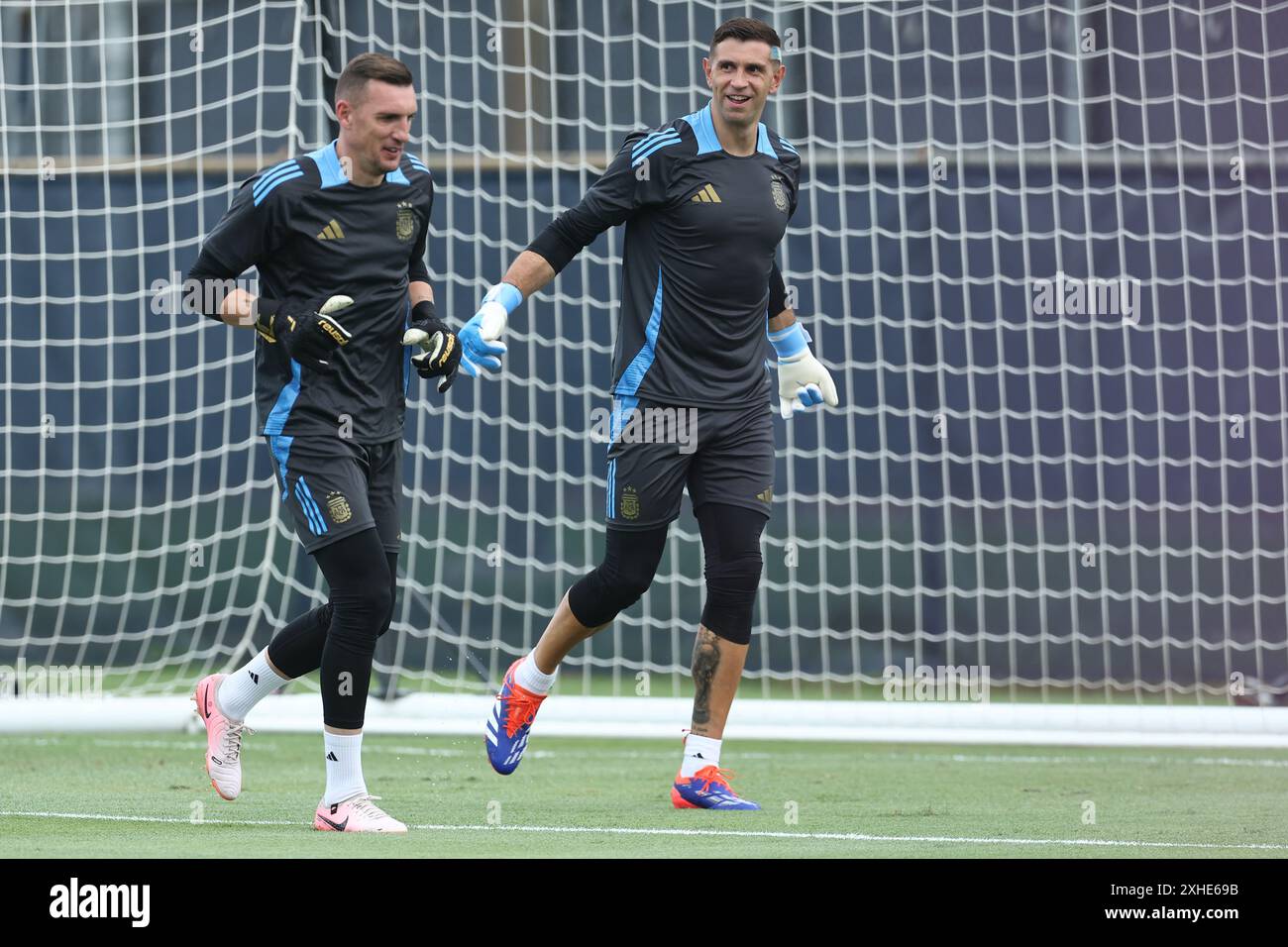 Argentina's goalkeepers (R) Emiliano Martinez and Franco Armani take ...