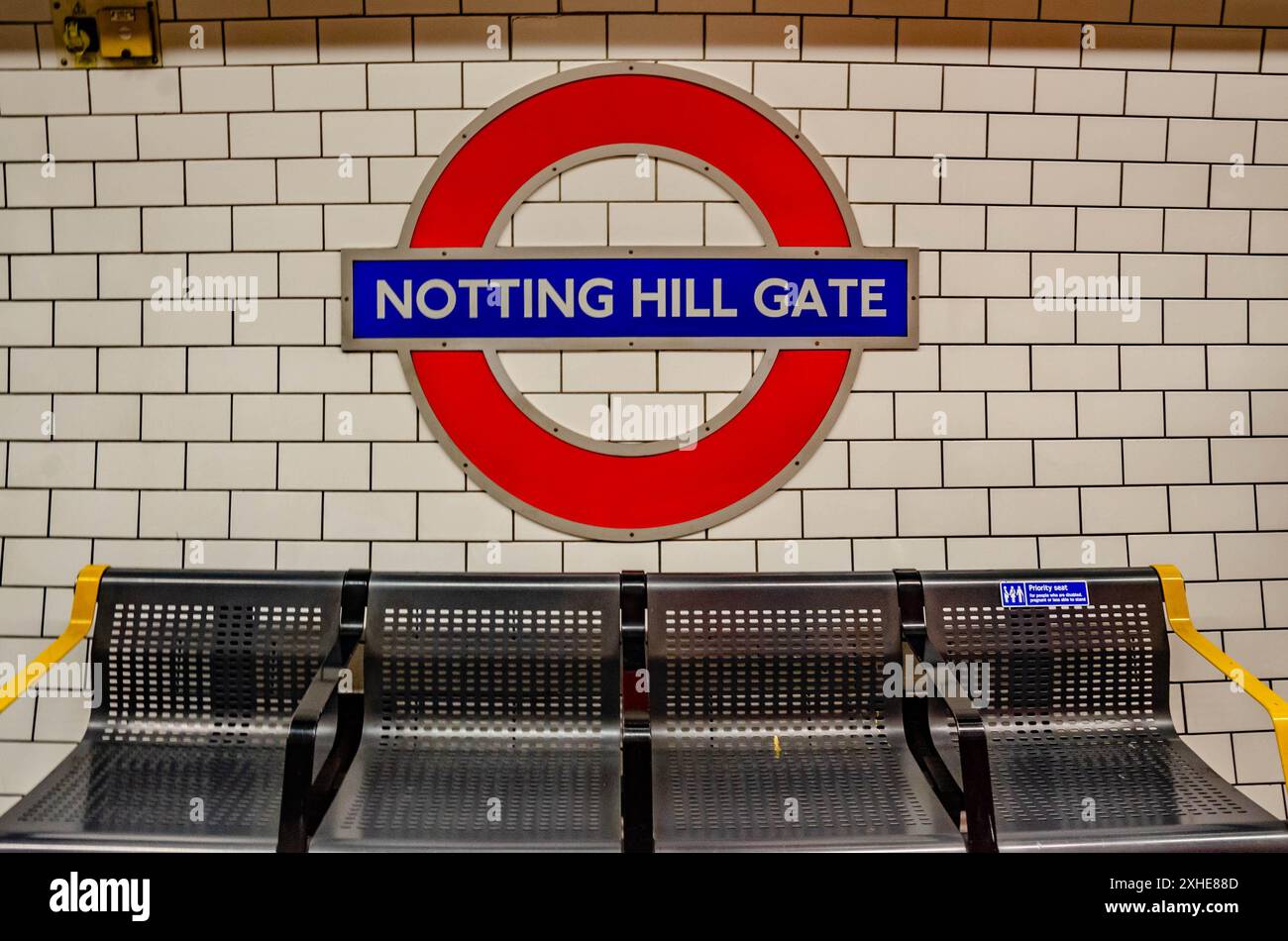 A London Underground symbol on the wall of Notting Hill Gate station ...