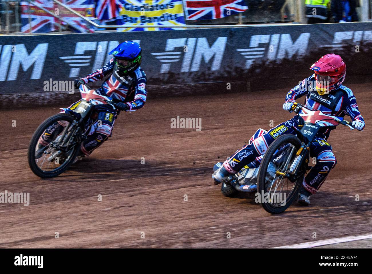 Robert Lambert of Great Britain in Red rides inside Dan Bewley of Great ...