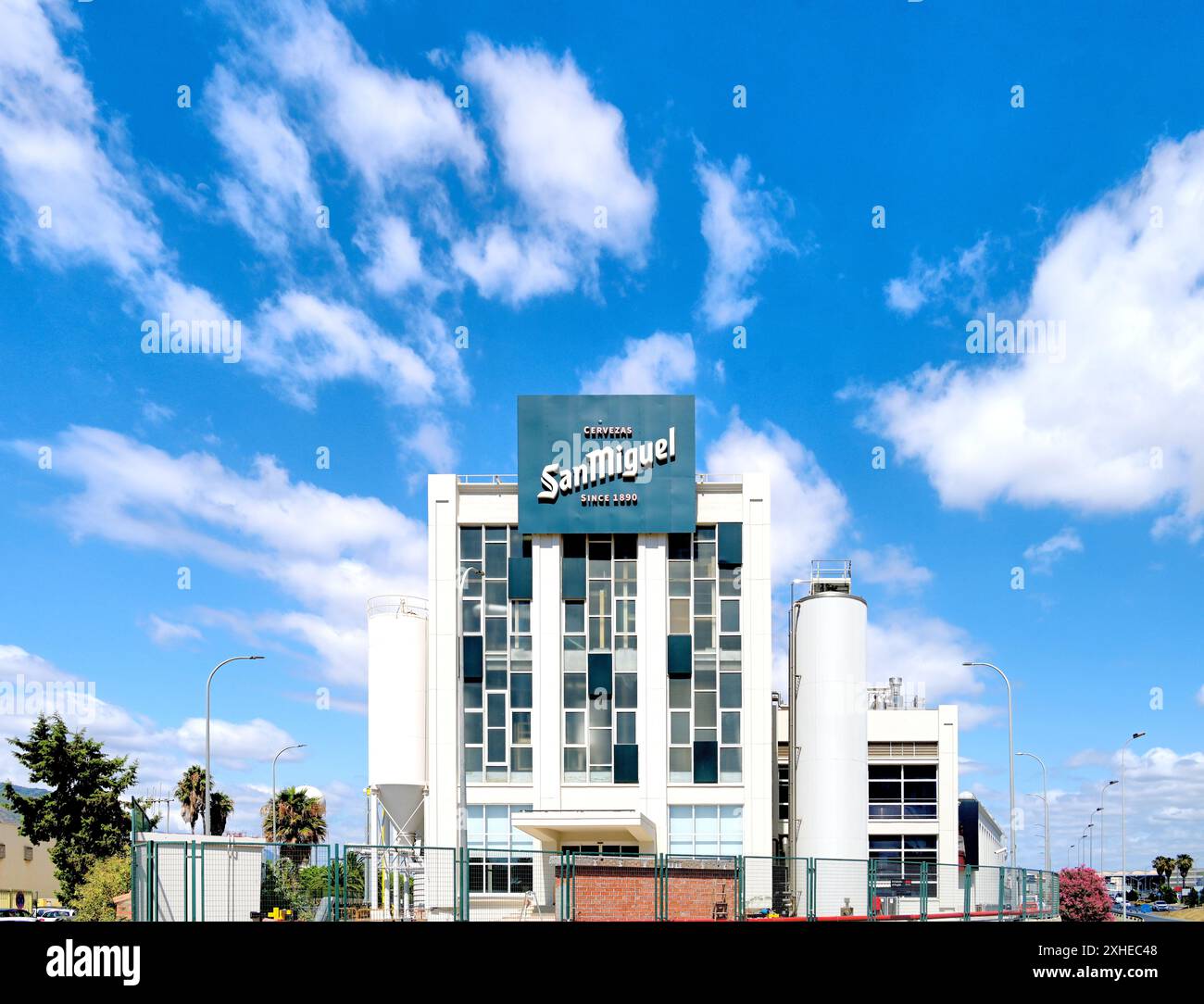 San Miguel Brewery factory buildings in Malaga against deep blue sky ...