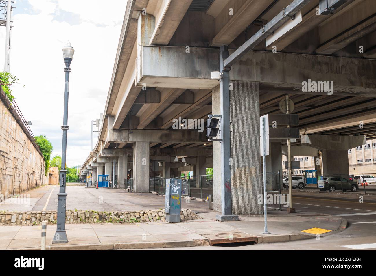 A parking lot under a highway bridge in Pittsburgh, Pennsylvania, USA ...