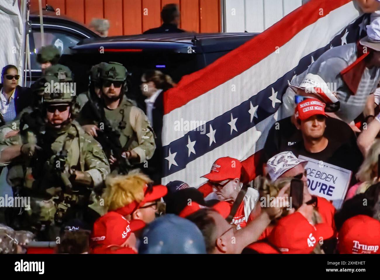 In this photo illustration, a screen shows US Special Forces cordoning ...