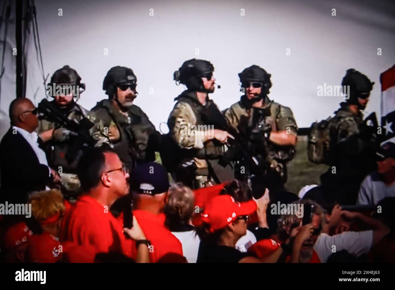 In this photo illustration, a screen shows US Special Forces cordoning ...