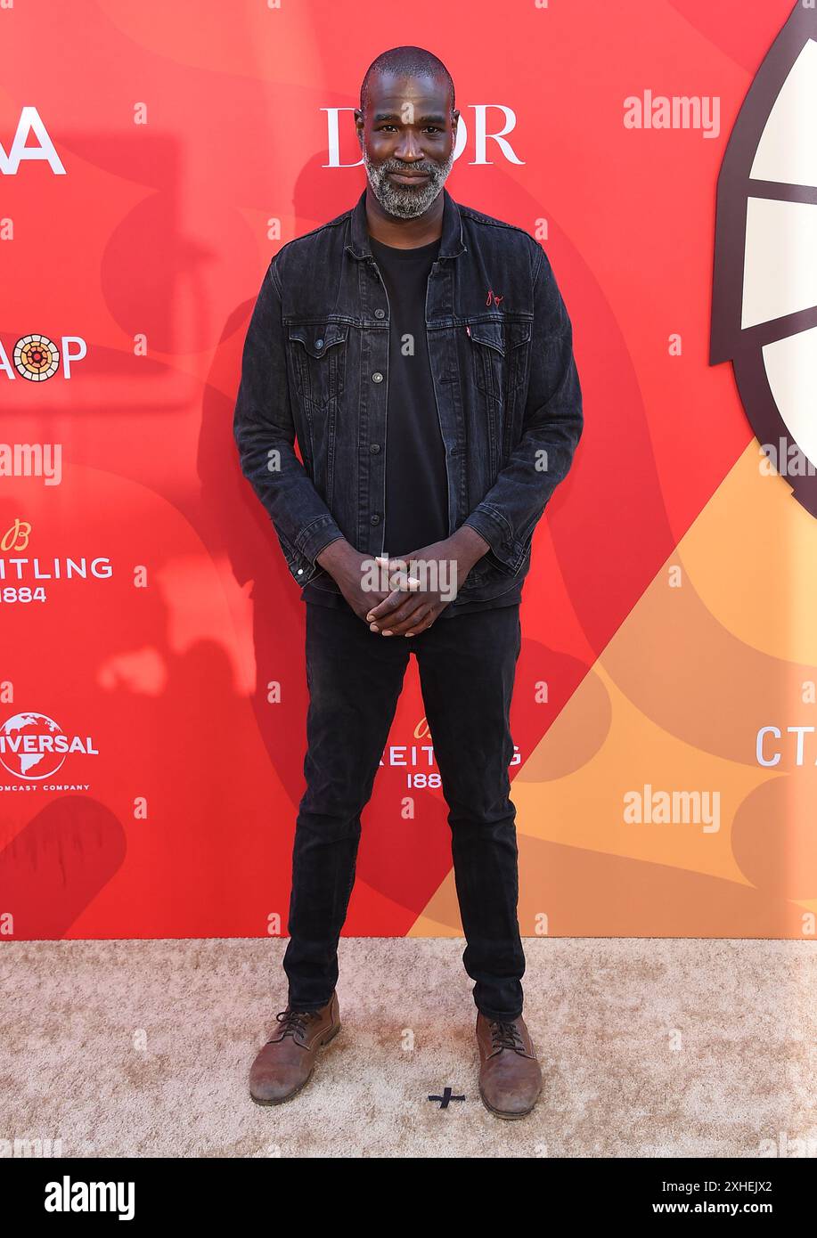 Tunde Adebimpe arriving to the Charlize Theron Africa Outreach Project ...