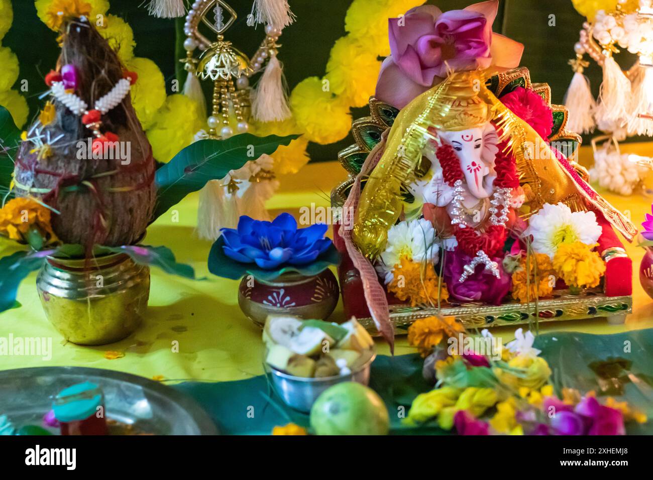holy hindu god ganesha idol with offerings pot or Kalasha on the ...