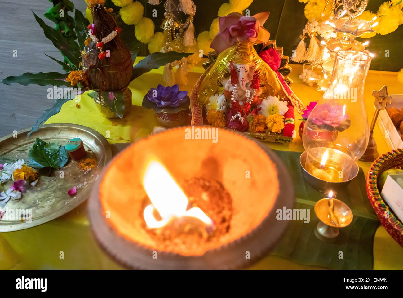 aarti of holy hindu god ganesha idol worship with holy offerings at ...