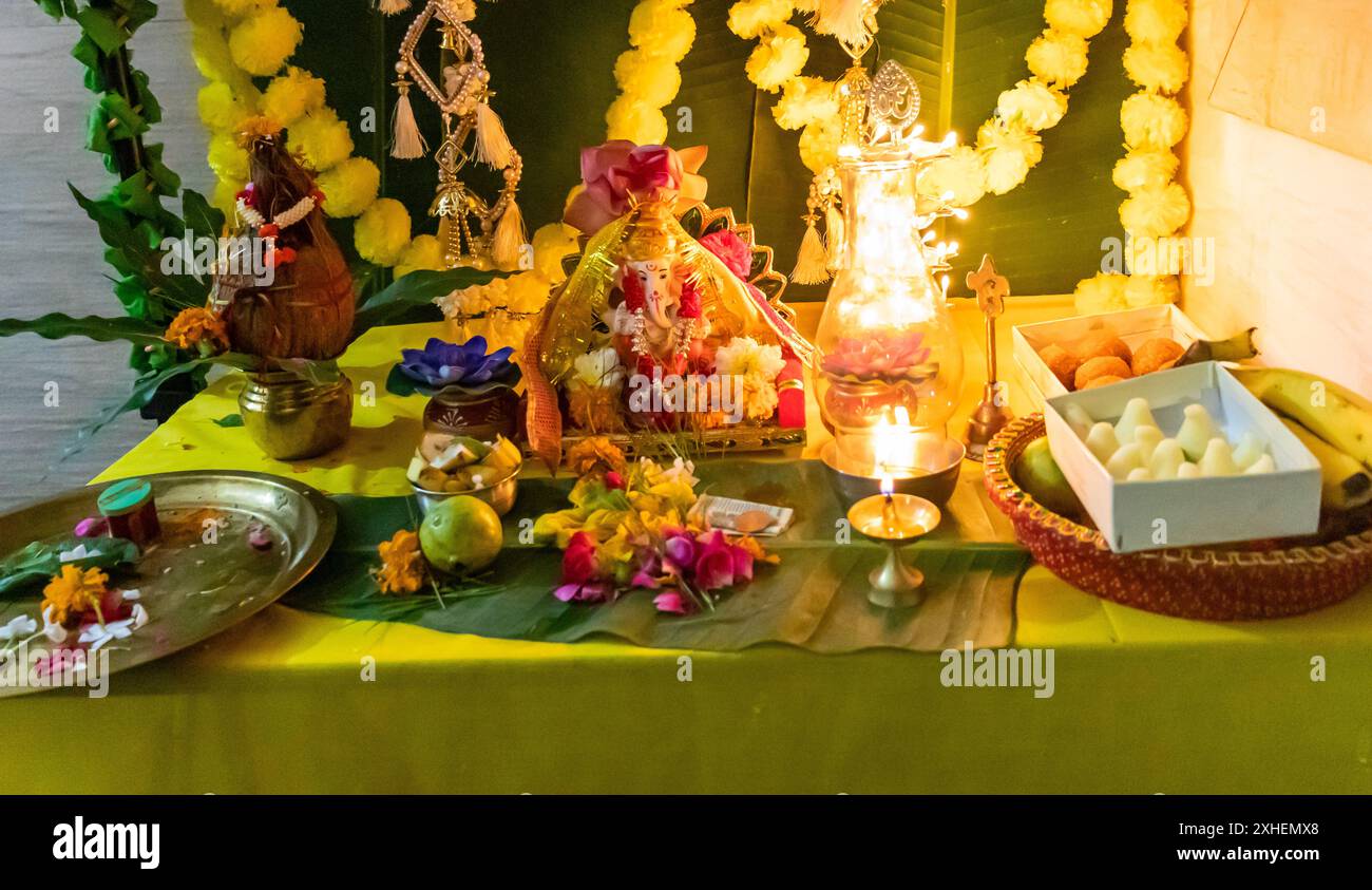 aarti of holy hindu god ganesha idol worship with holy offerings at ...