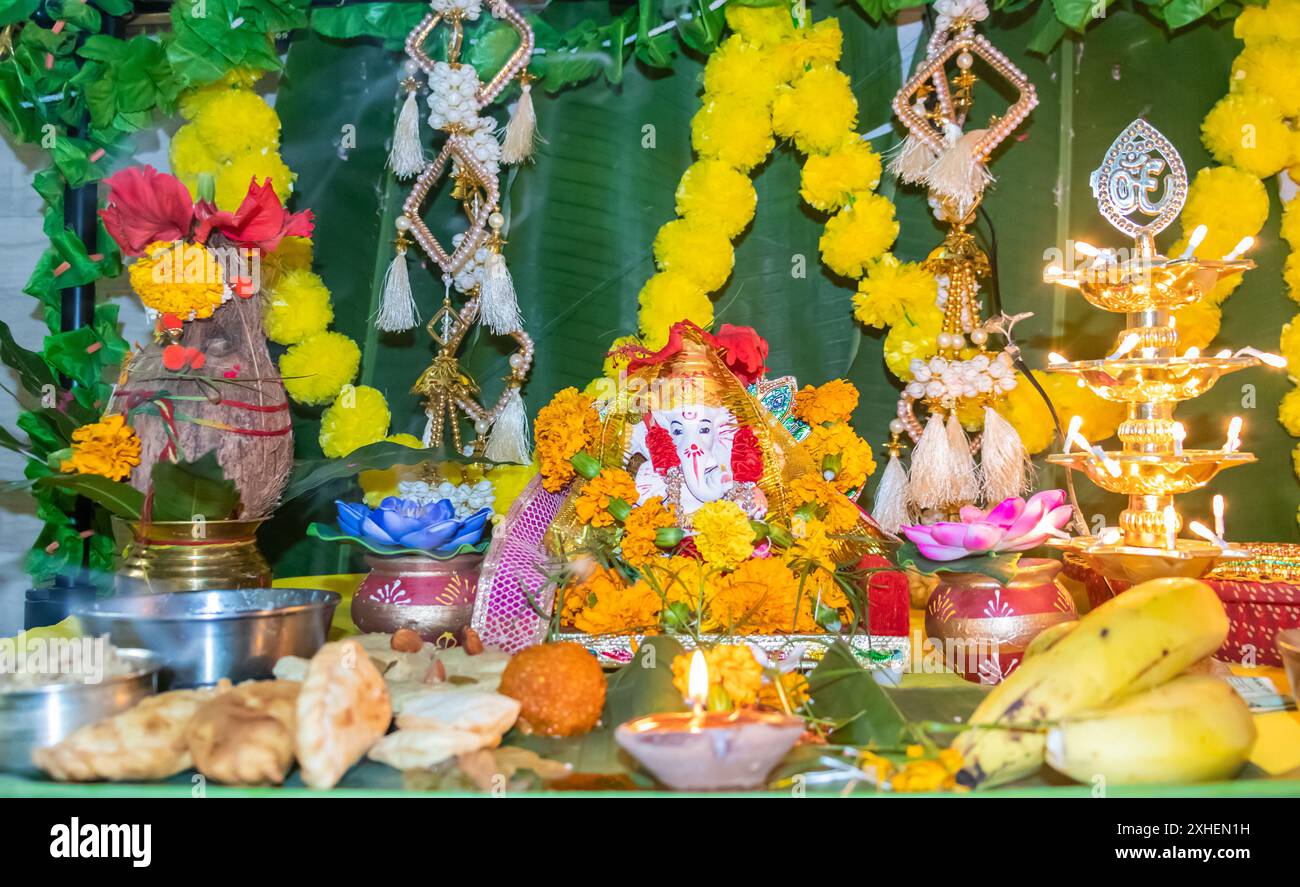 holy hindu god ganesha idol worship with holy offering and decoration ...