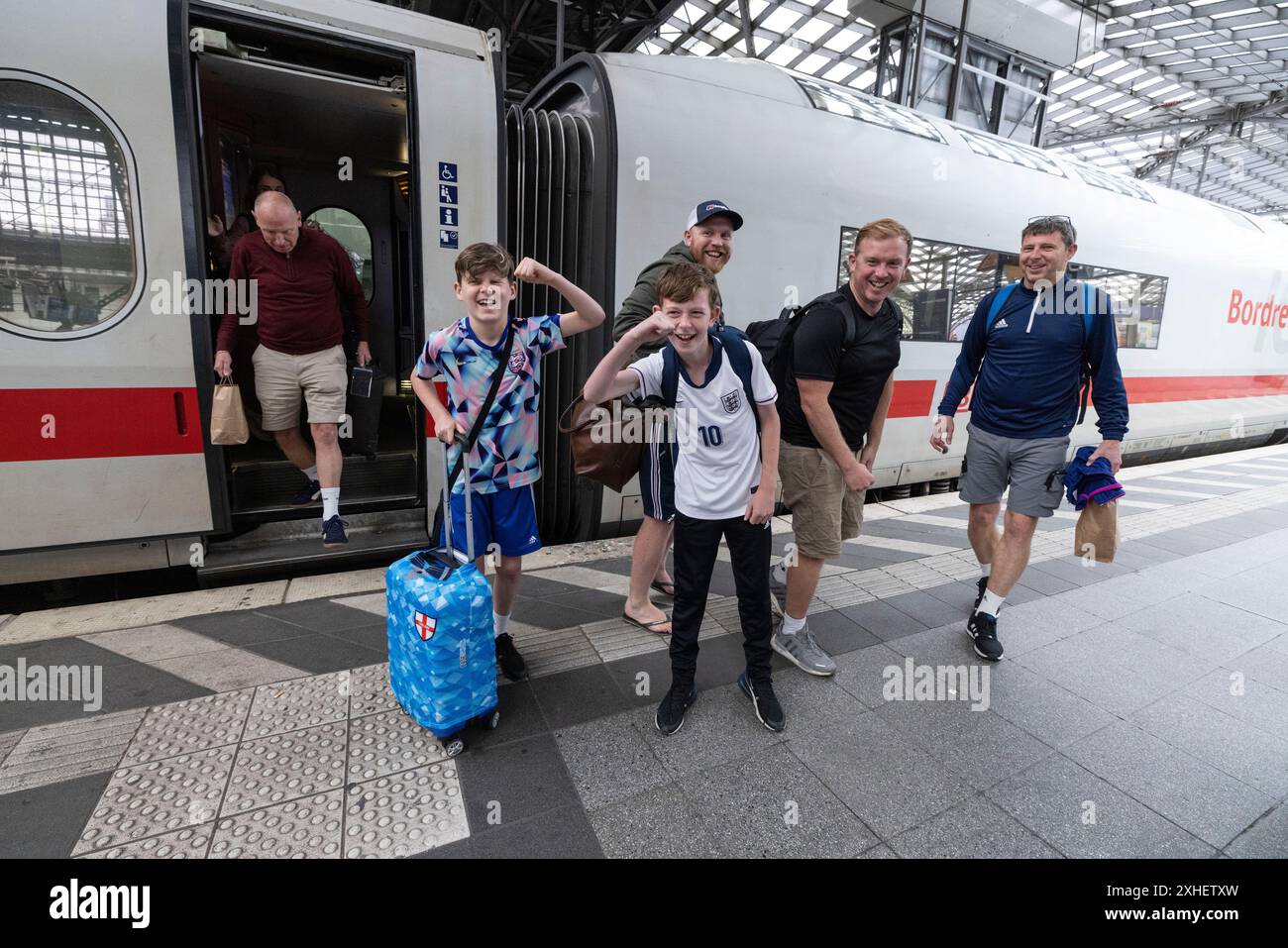 England fans and family members make their way to Berlin on the train ...