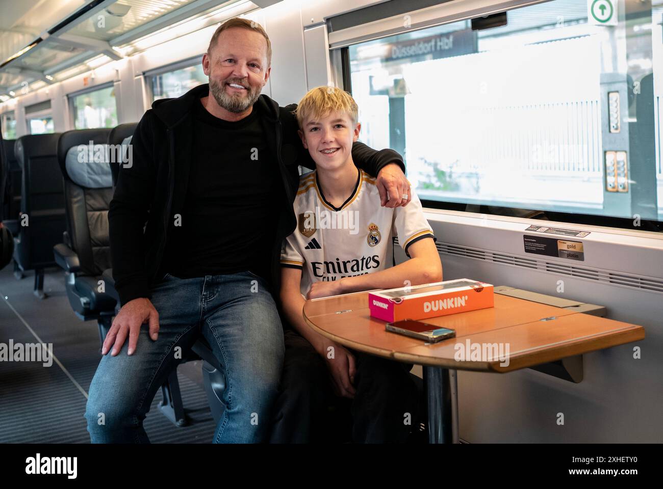 England fans and family members make their way to Berlin on the train ...
